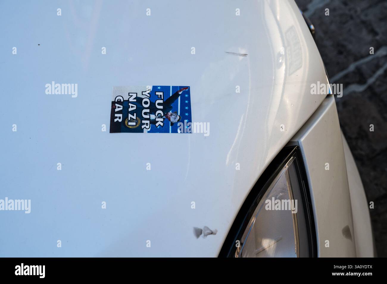 Seattle, USA. 5th Mar 2025. Anti - Elon Musk stickers seen on a Tesla ...