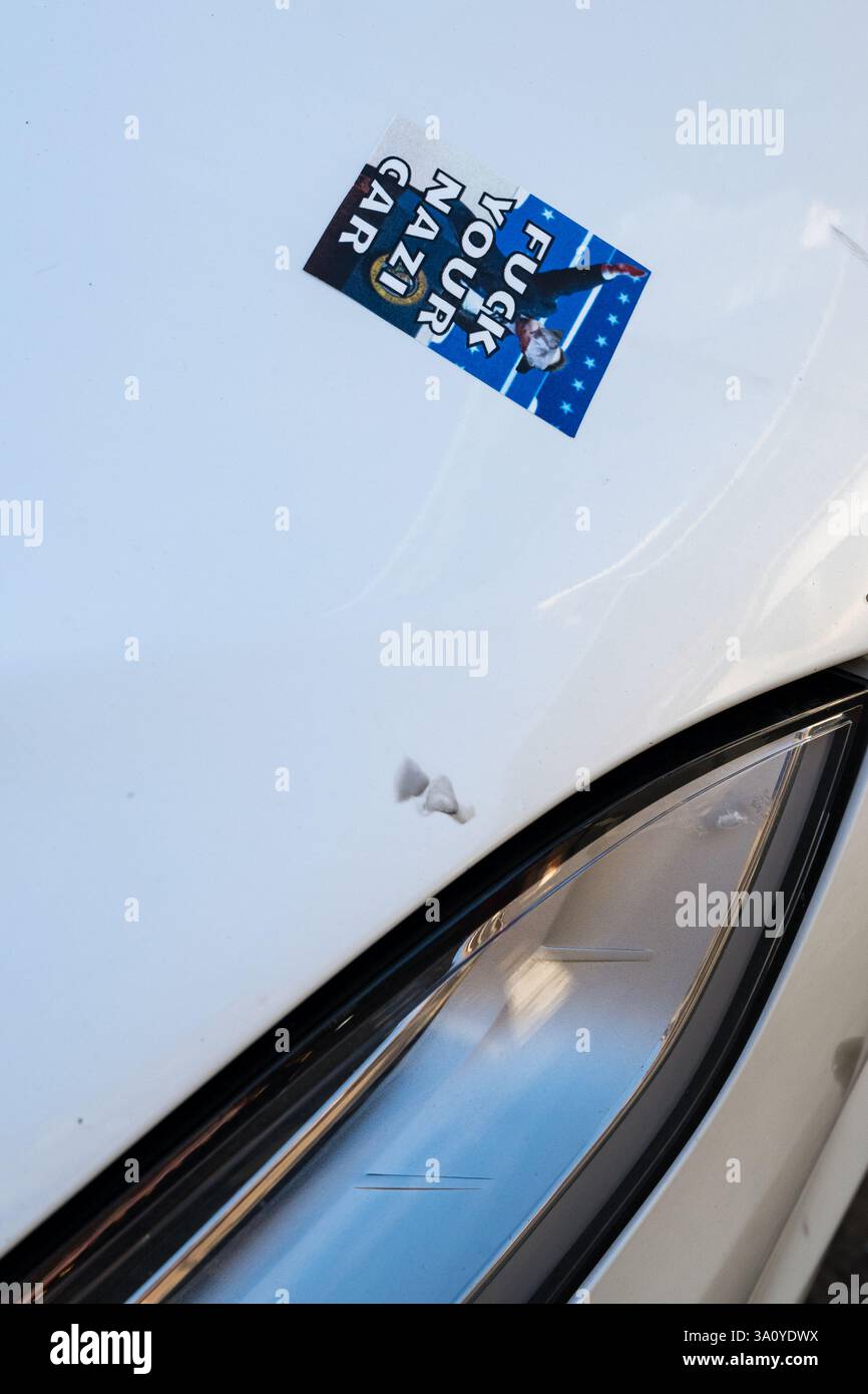 Seattle, USA. 5th Mar 2025. Anti - Elon Musk stickers seen on a Tesla ...