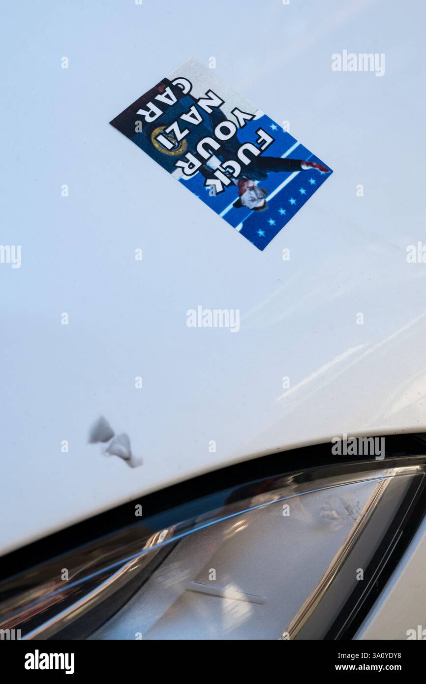 Seattle, USA. 5th Mar 2025. Anti - Elon Musk stickers seen on a Tesla ...