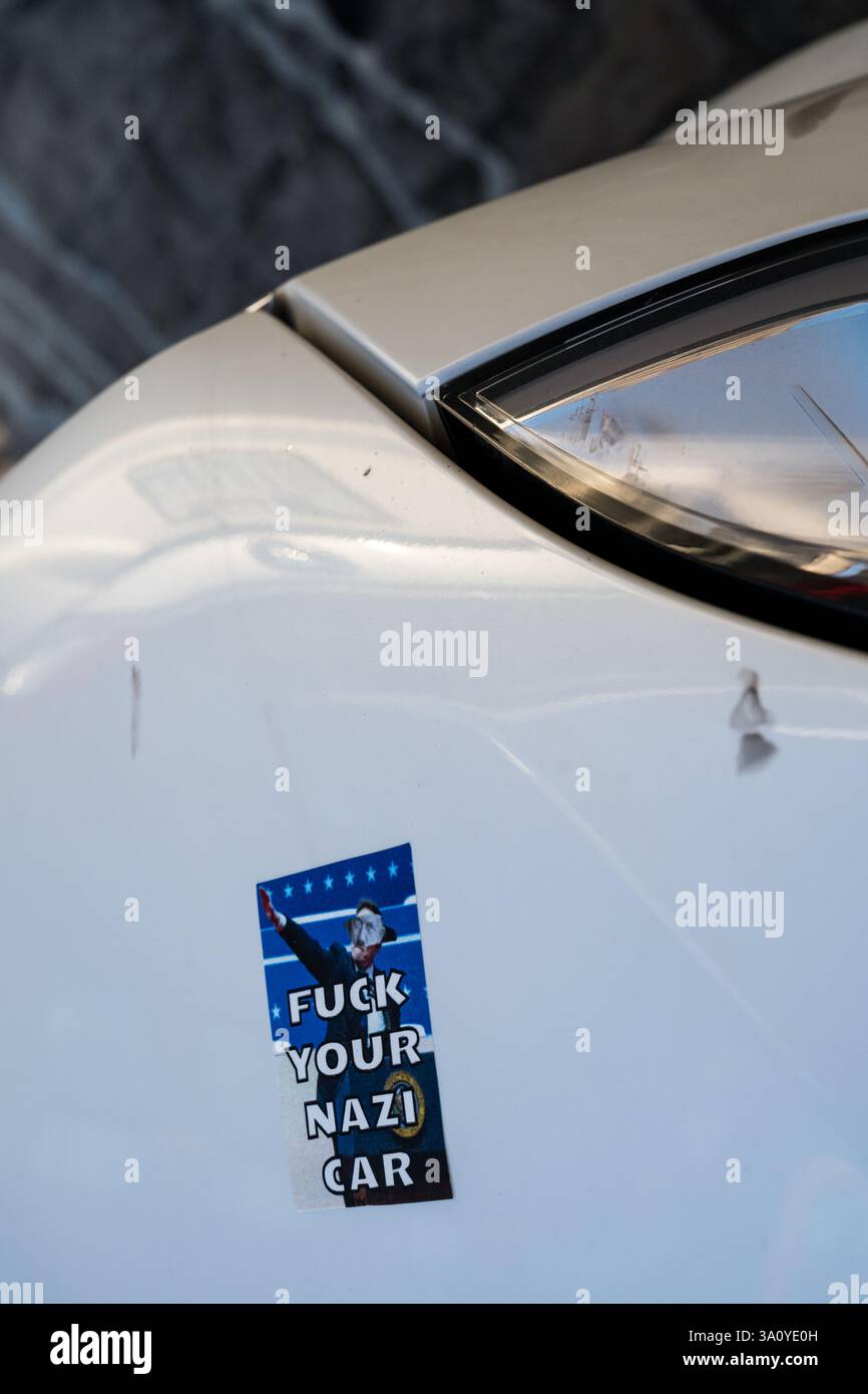 Seattle, USA. 5th Mar 2025. Anti - Elon Musk stickers seen on a Tesla ...