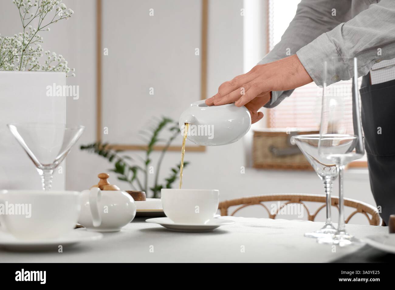 Male waiter butler serving pouring hi-res stock photography and images ...