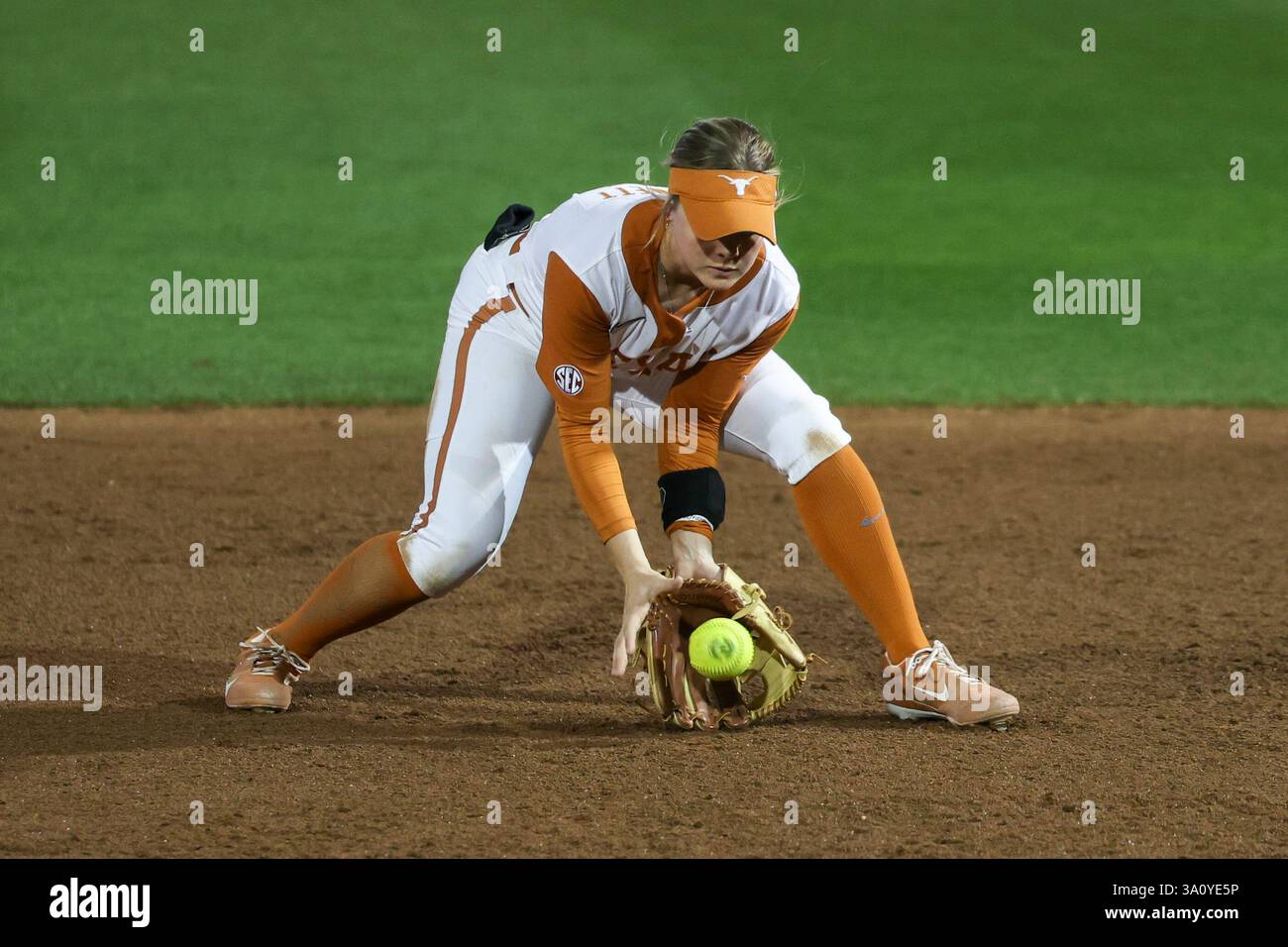 AUSTIN, TX - MARCH 05: Texas utility Kaydee Bennett (5) fields a ground ...