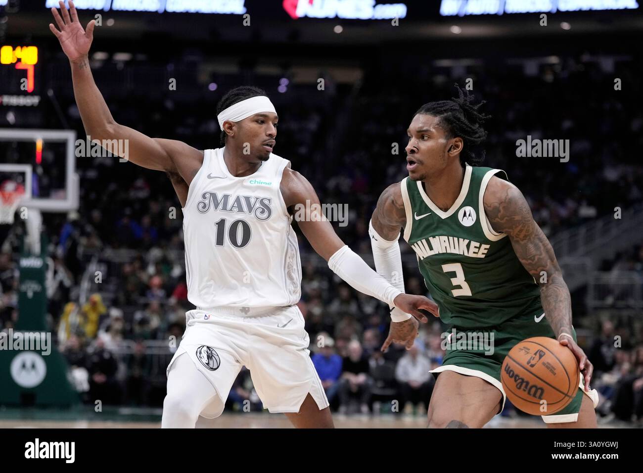 Milwaukee Bucks' Kevin Porter Jr. gets past Dallas Mavericks' Brandon ...