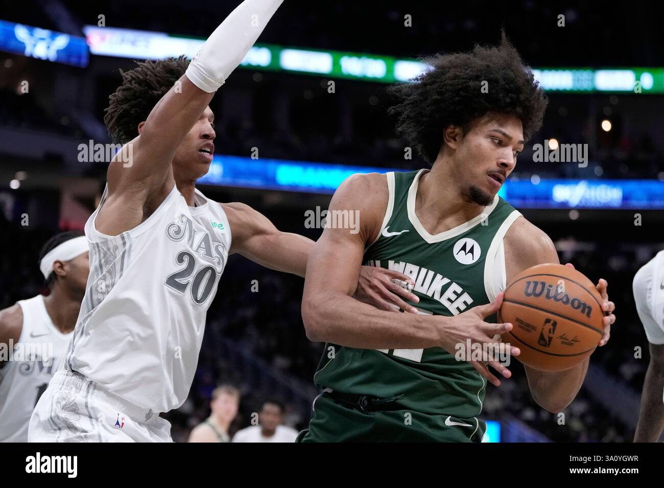 Milwaukee Bucks' Jericho Sims rebounds in front of Dallas Mavericks ...