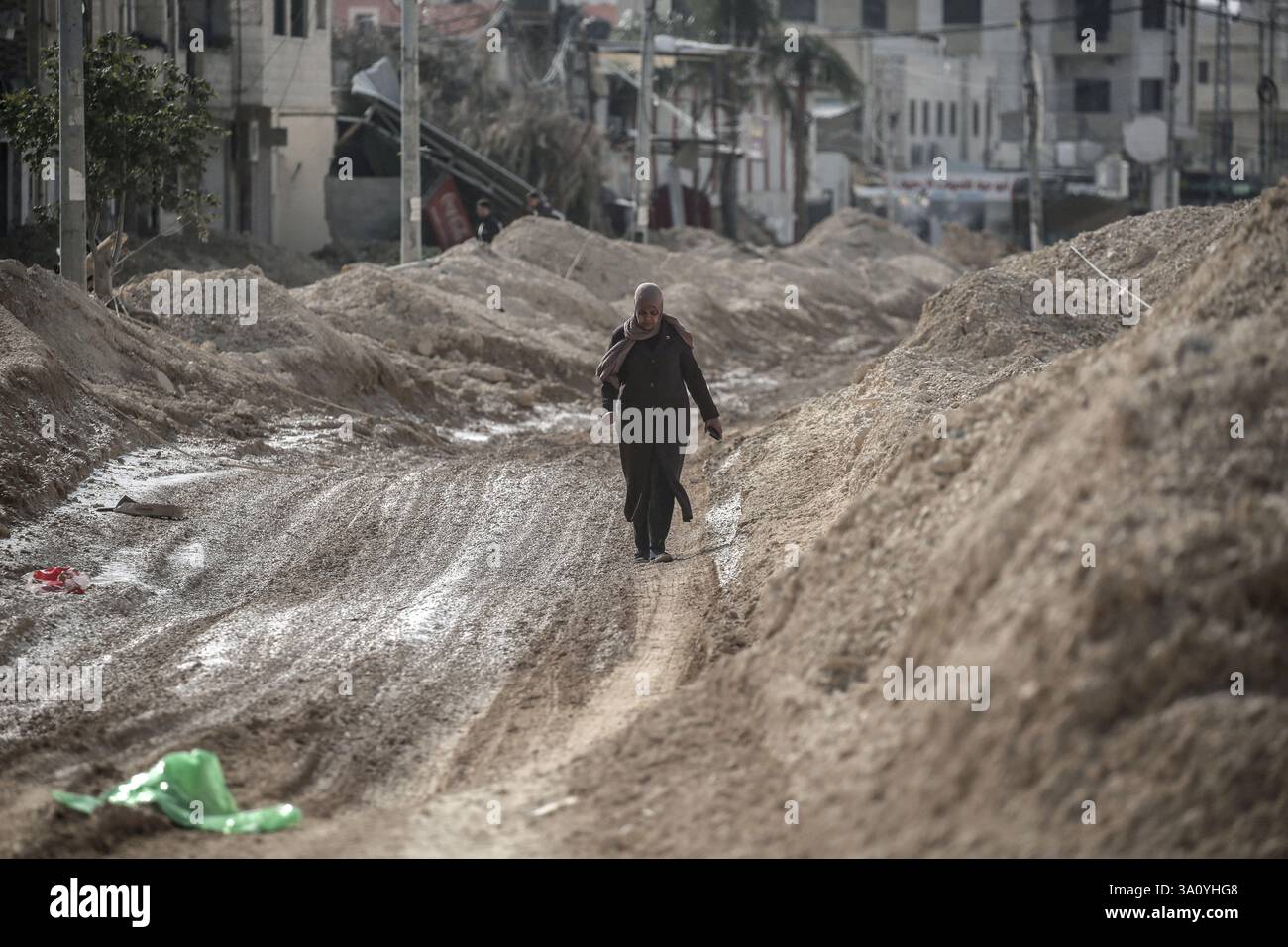 Tulkarm, Palestine. 05th Mar, 2025. A Palestinian woman walks in the ...