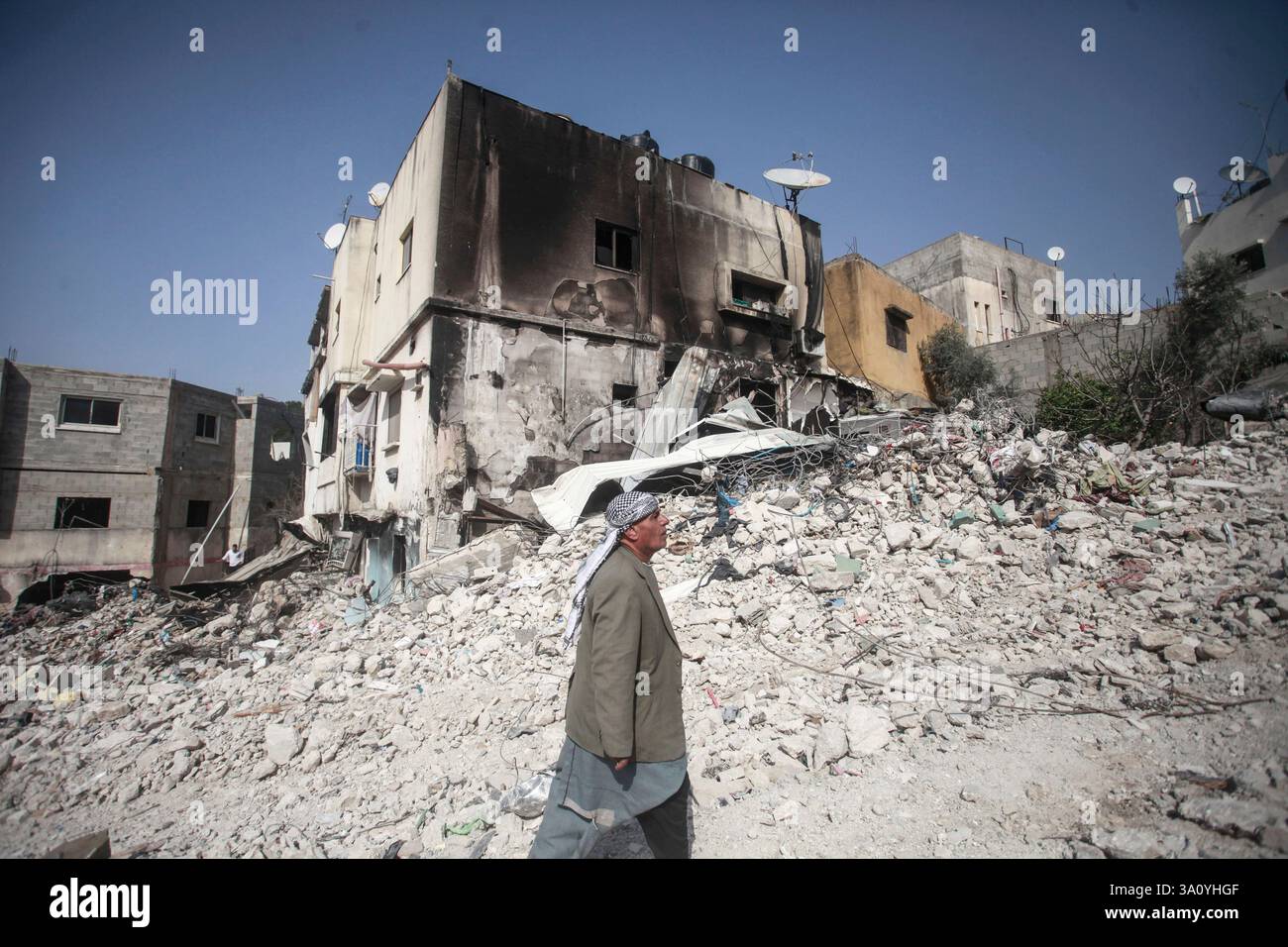 Tulkarm, Palestine. 05th Mar, 2025. An elderly Palestinian man walks ...
