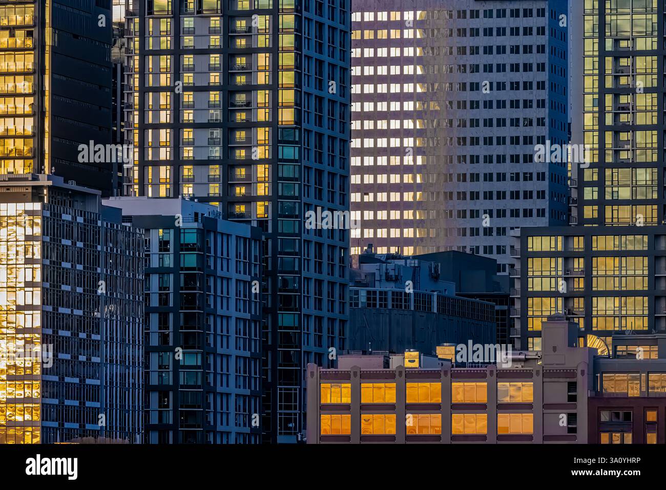 Waterfront buildings reflecting winter sunset in Seattle, Washington ...