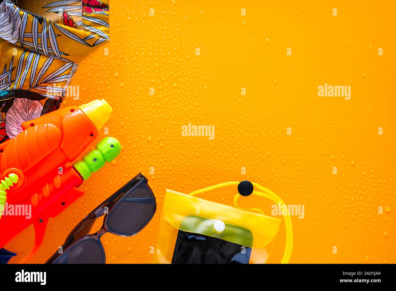 Colorful shirt with water gun, waterproof case for smartphone and ...