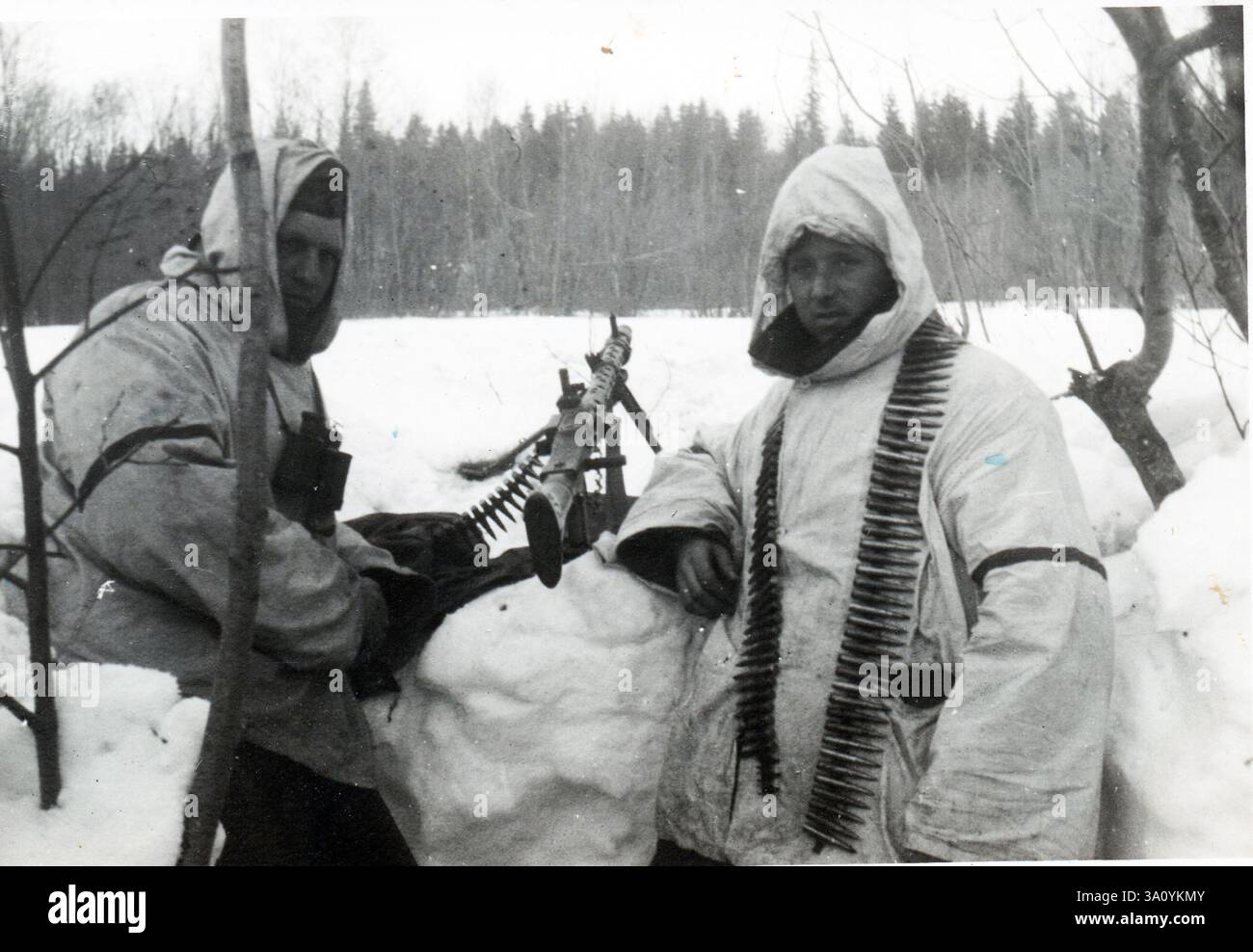 World War Two B&W photo Two German soldiers look back at the Cameraman ...