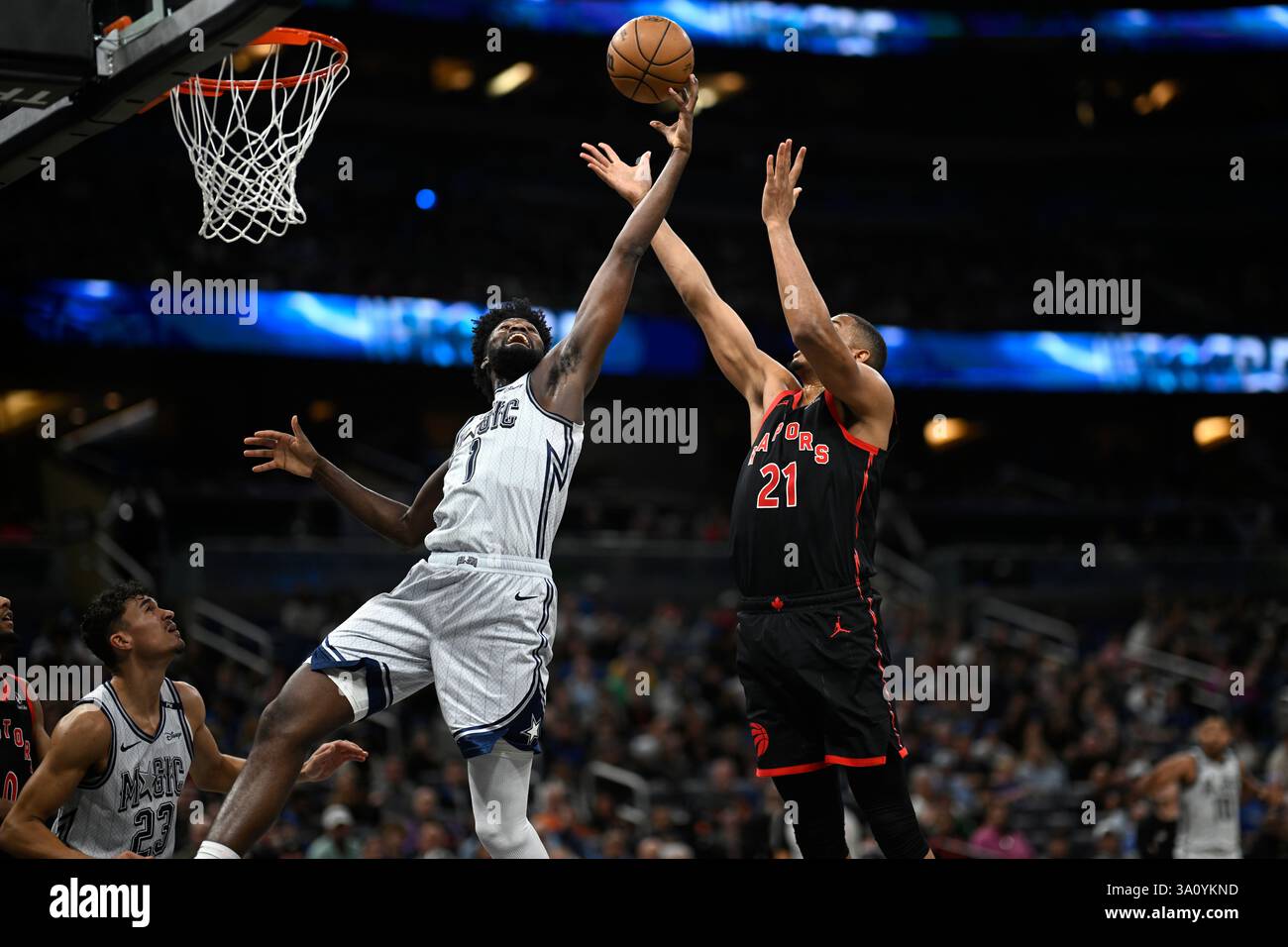 Orlando Magic forward Jonathan Isaac (1) and Toronto Raptors center ...