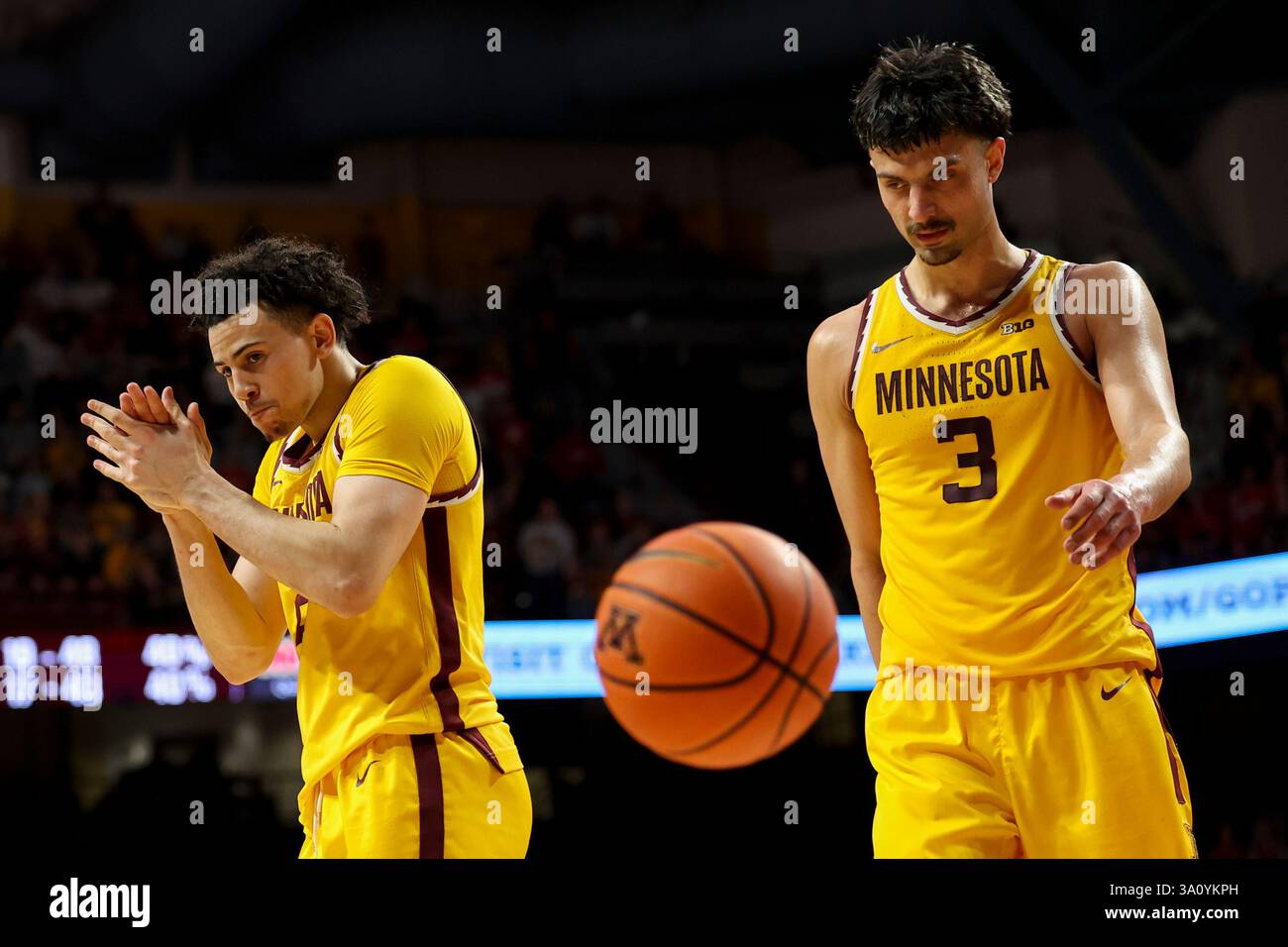 Minnesota guard Mike Mitchell Jr., left, pumps up his team while ...
