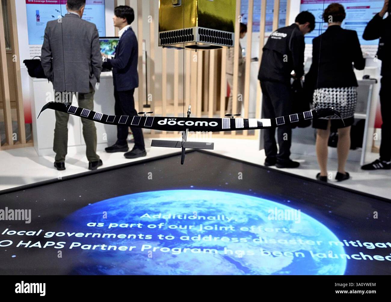 A glider-like model of "flying base station" is exhibited at NTT DOCOMO ...