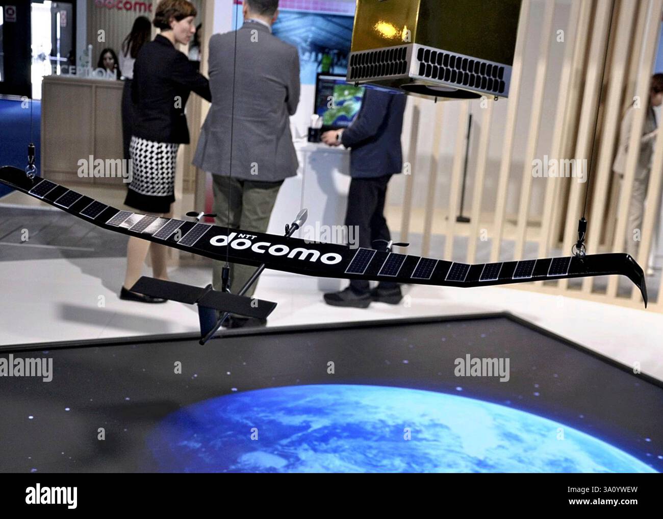 A glider-like model of "flying base station" is exhibited at NTT DOCOMO ...