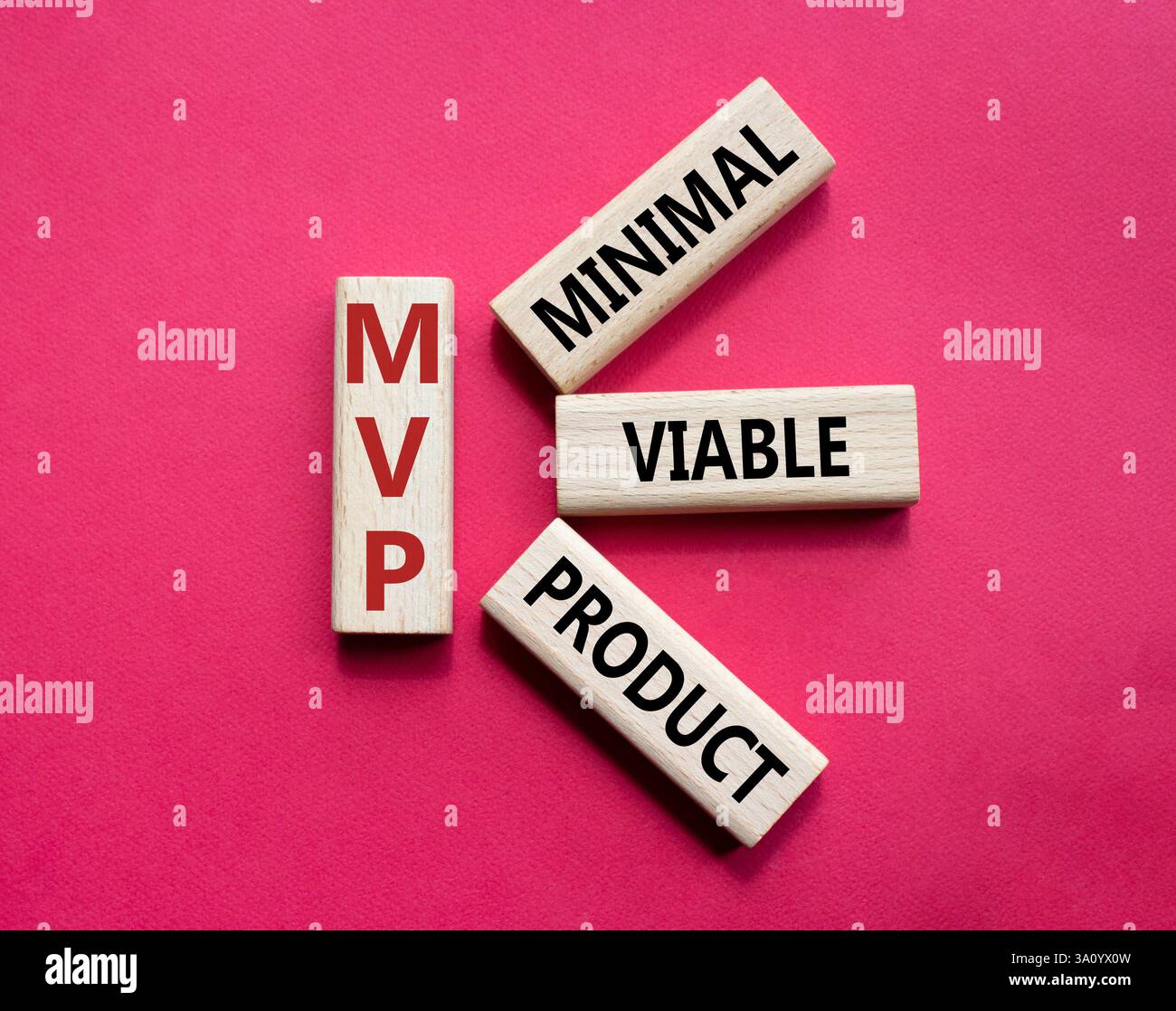 MVP - Most Valuable Player symbol. Wooden cubes with words MVP. Beautiful red background ...