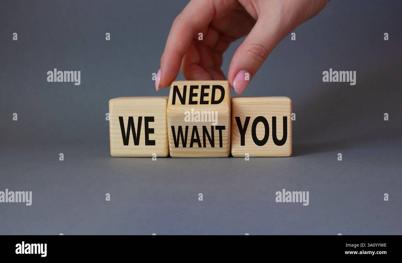 We need and want You symbol. Businessman Hand turns cubes and changes ...
