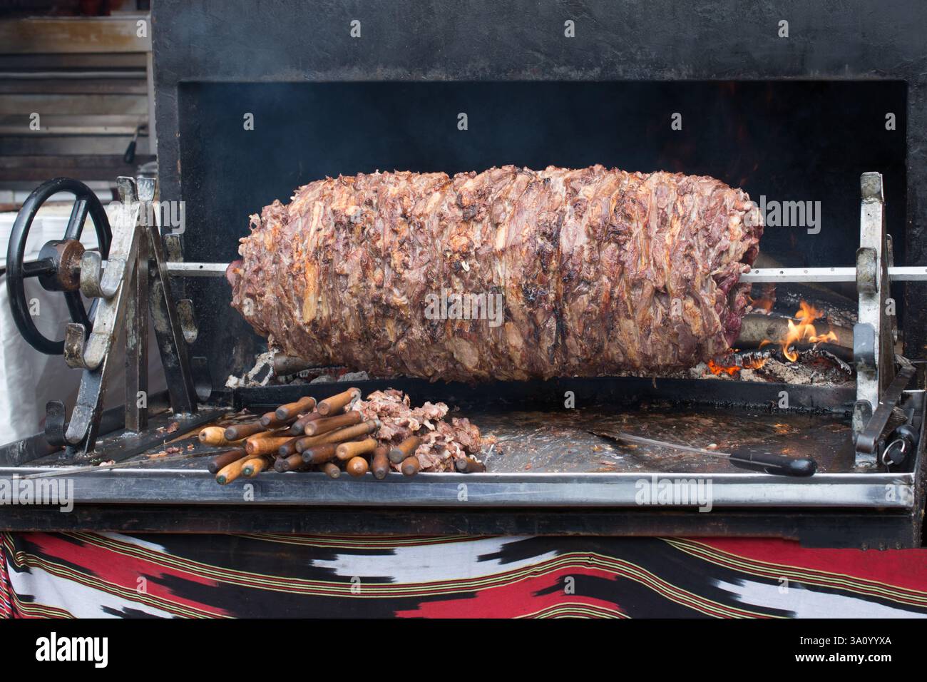 Turkish cag Kebab on pole in horizontal position Stock Photo - Alamy