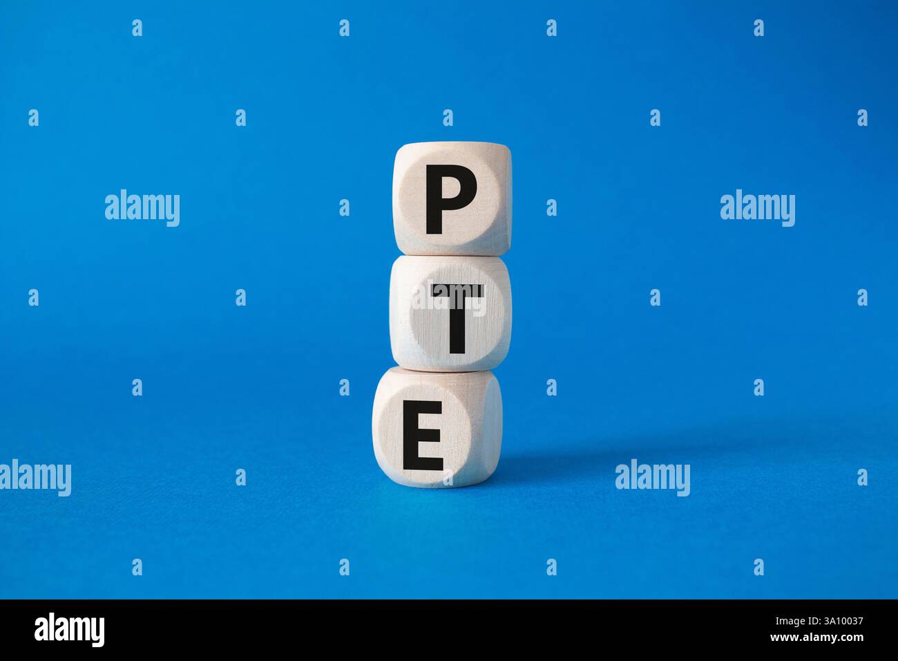 PTE - Pearson Tests of English symbol. Wooden cubes with word PTE ...