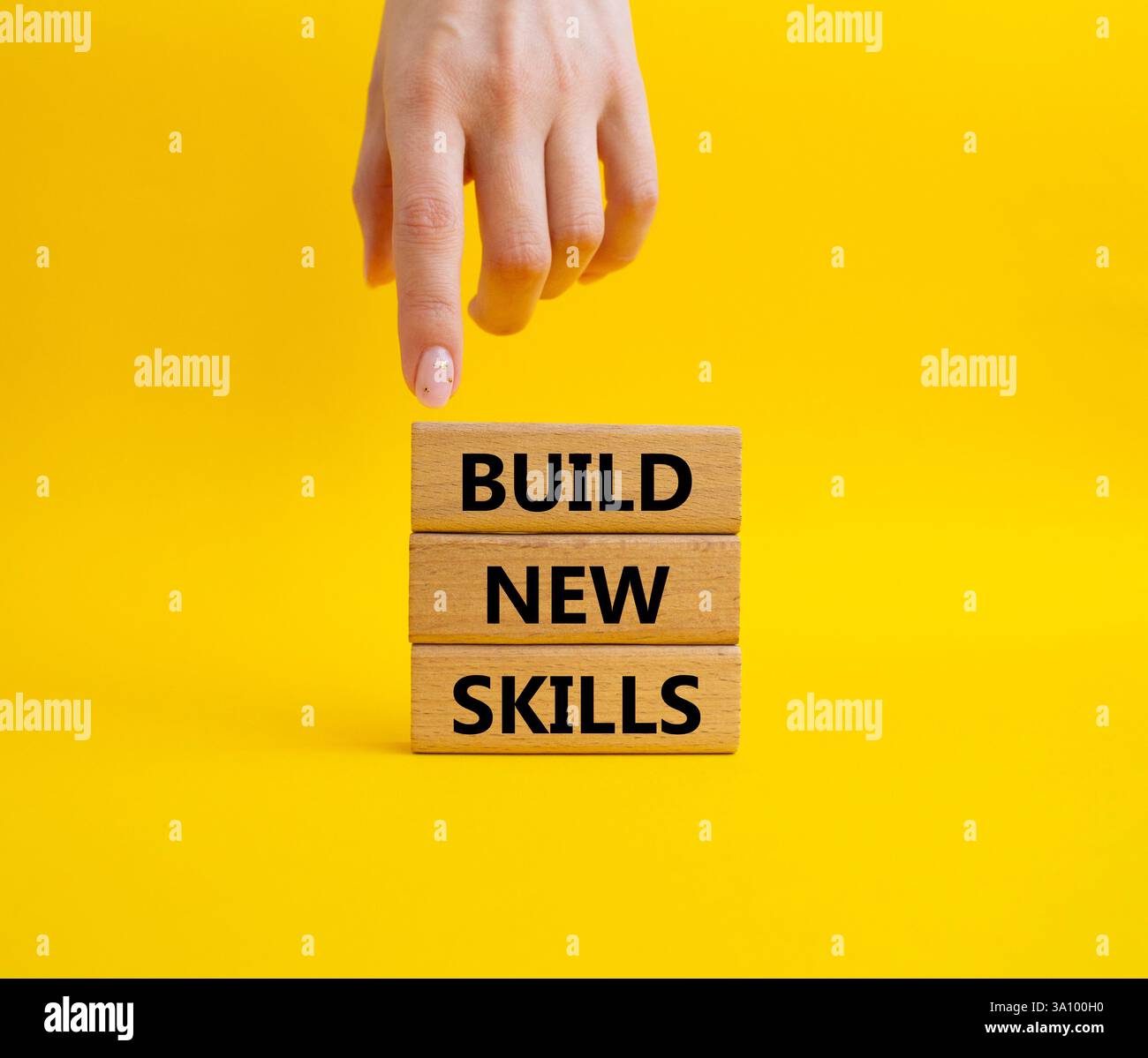 Build New skills symbol. Concept word Build New skills on wooden blocks ...