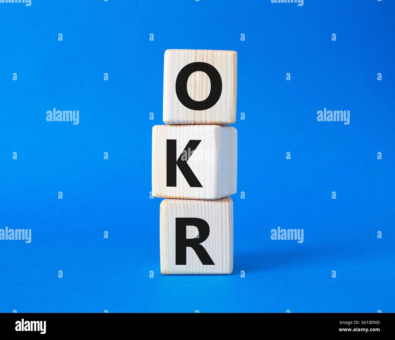 OKR objectives and key results symbol. Wooden cubes with words OKR ...