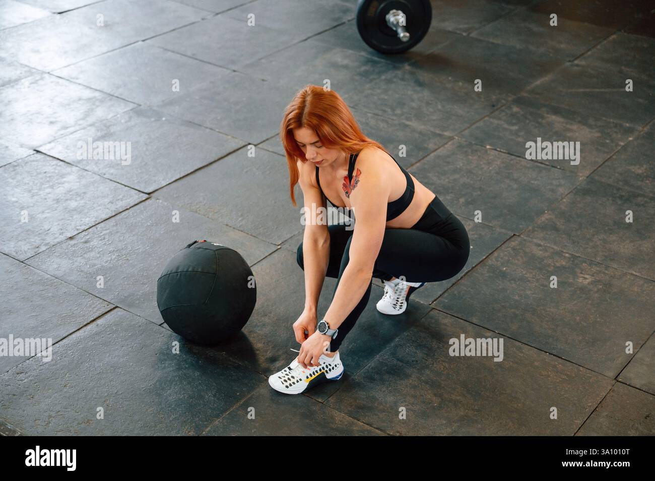 Beautiful strong woman is in the gym Stock Photo - Alamy