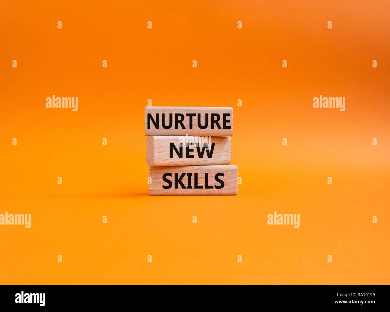 Nurture new skills symbol. Concept words Nurture new skills on wooden ...