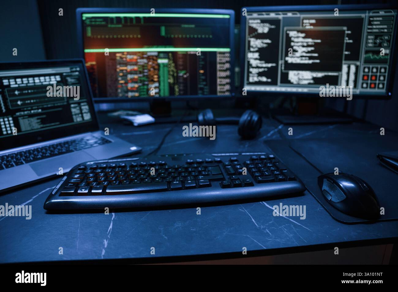 Keyboard and screens. Cyber criminal haker dark room for massive attack ...