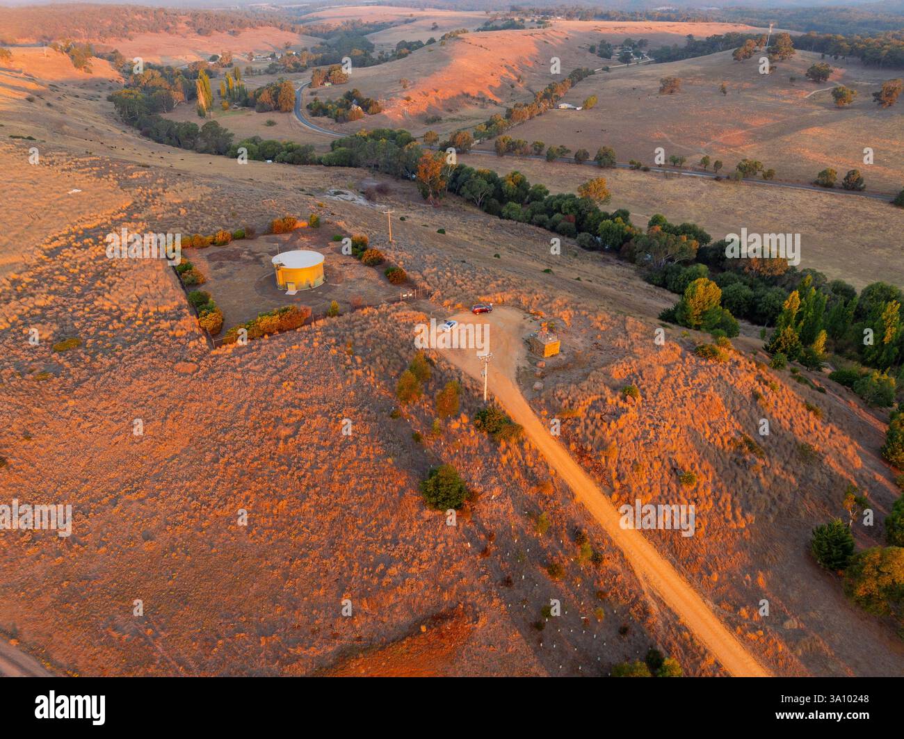 Aerial view of a dirt road leading to a lookout on the top of a dry ...