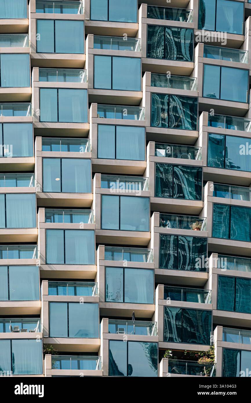 fragment of apartment building with similar floor to ceiling windows ...