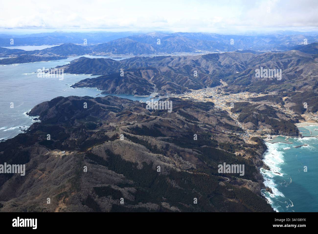 Aerial photo shows the mountain surface scorched black by forest fires ...