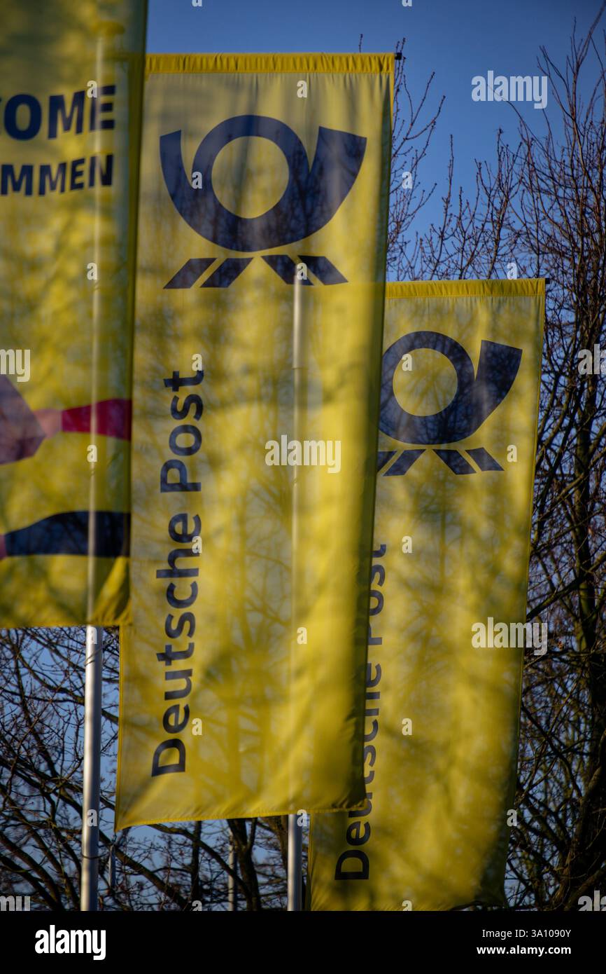 06 March 2025, North Rhine-Westphalia, Cologne: Yellow flags with post ...