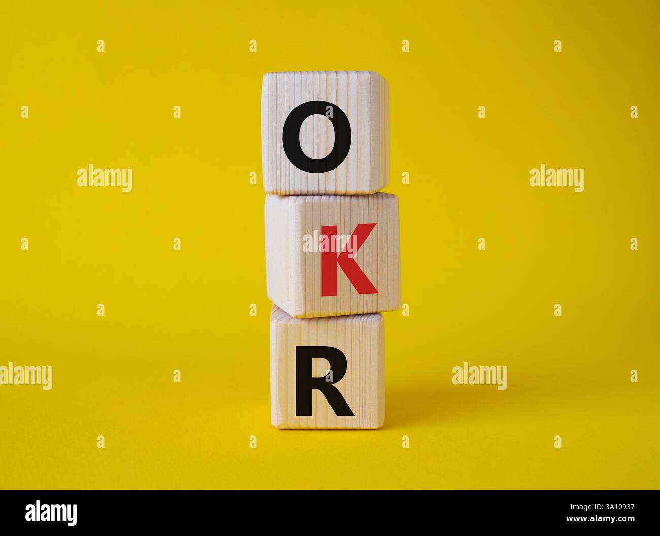 OKR objectives and key results symbol. Wooden cubes with words OKR ...