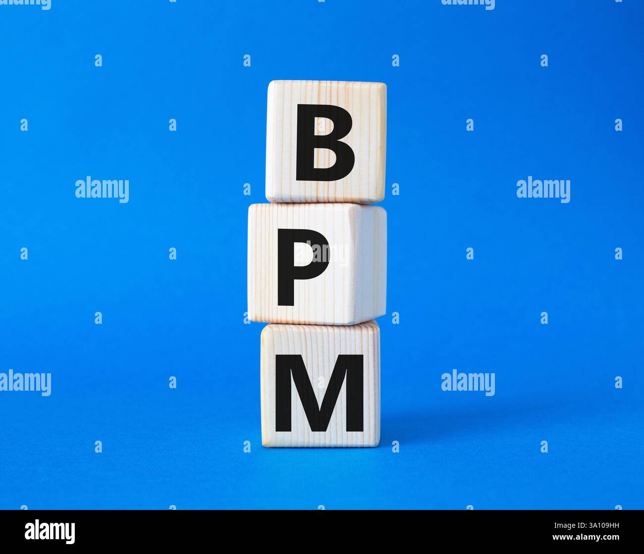 BPM - Business Process Management symbol. Wooden cubes with words BPM ...