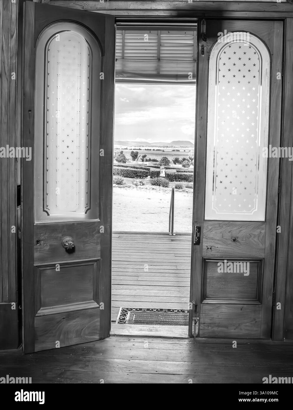On the inside looking out. Looking out a timber and glass doorway with ...