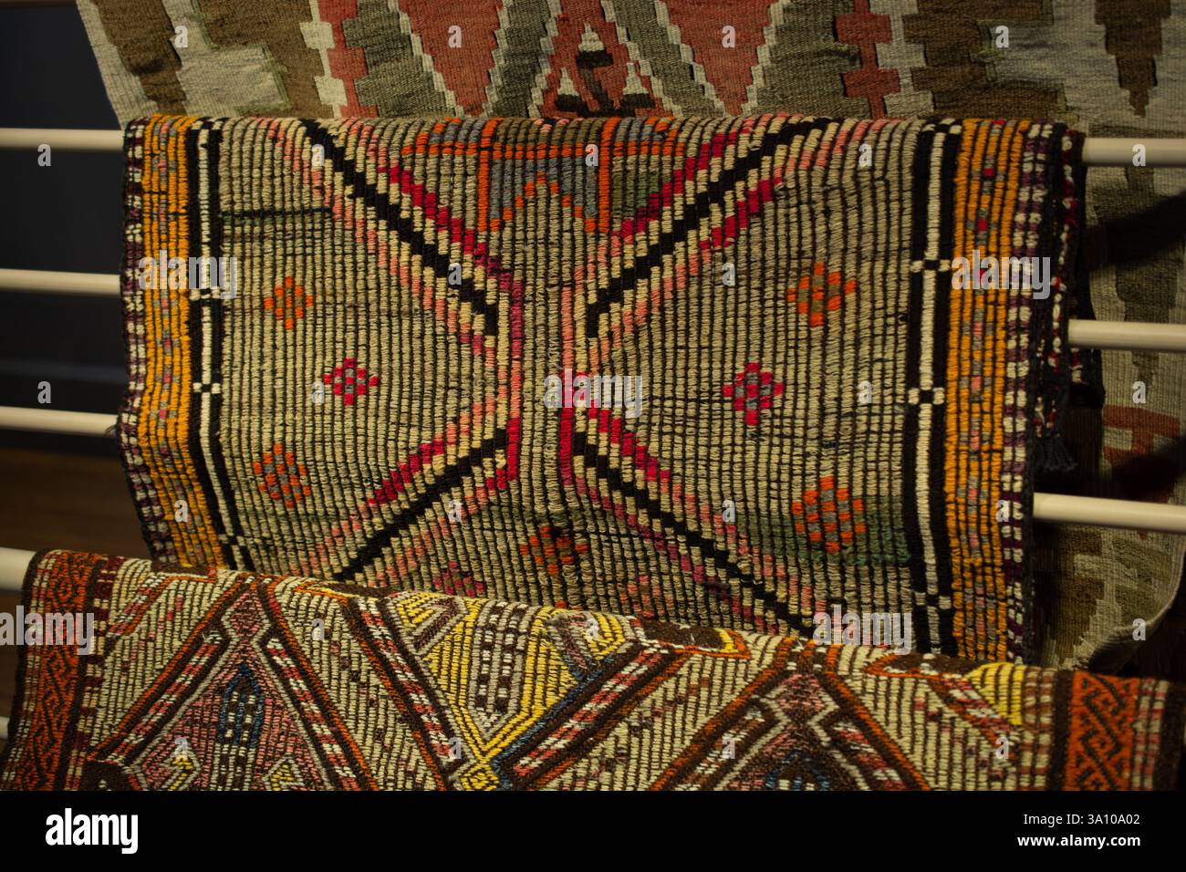 Traditional Turkish rug textile with patterns in bazaar Stock Photo - Alamy