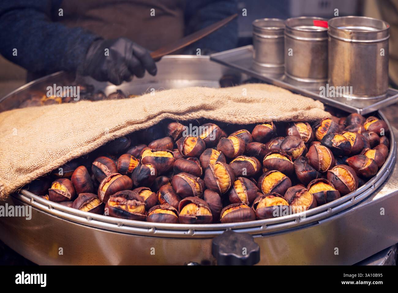 Large metal pan filled with freshly roasted chestnuts golden interiors ...