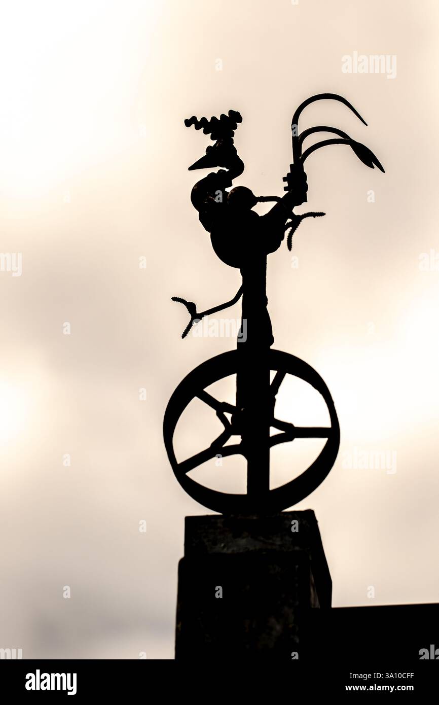 Street Art, Silhouette of Rooster on a circus wheel, street sculpture ...