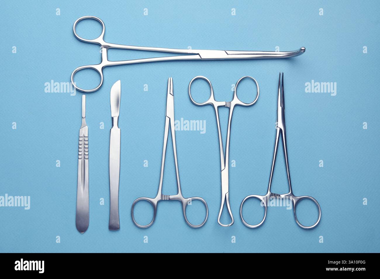Different surgical tools on light blue background, flat lay Stock Photo ...