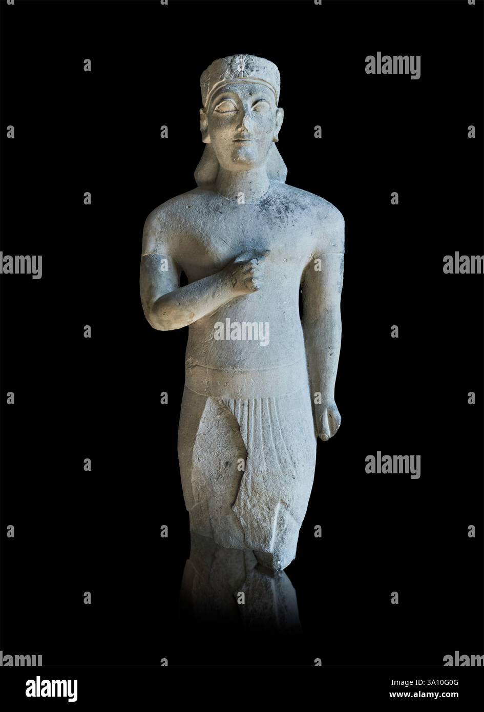 Ancient Greek Cypriot statue of a male with a rosette diadem. The style ...