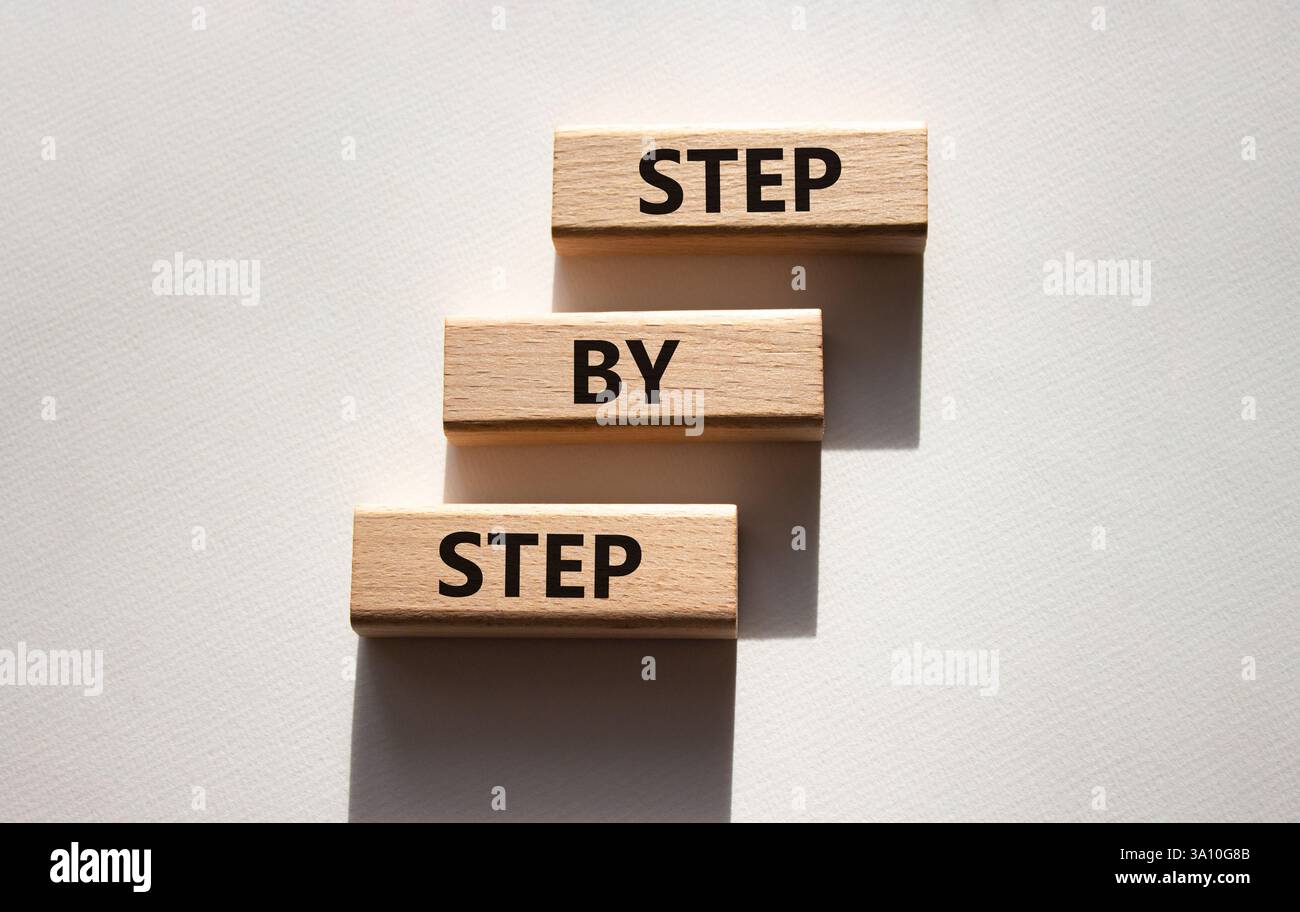Step by step symbol. Wooden blocks with words Step by step. Beautiful ...