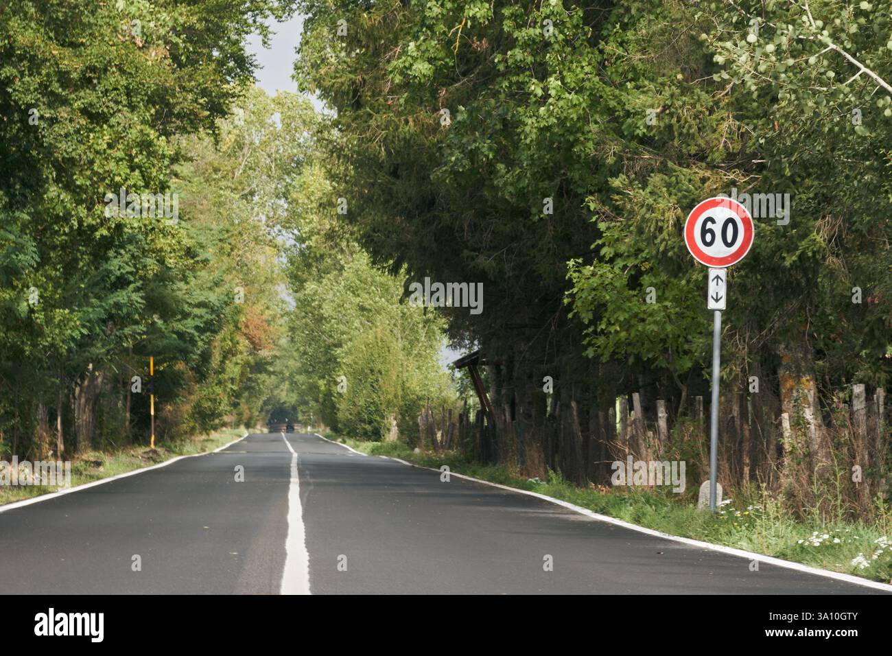 A road sign of speed limit of 60 against green grass Stock Photo - Alamy