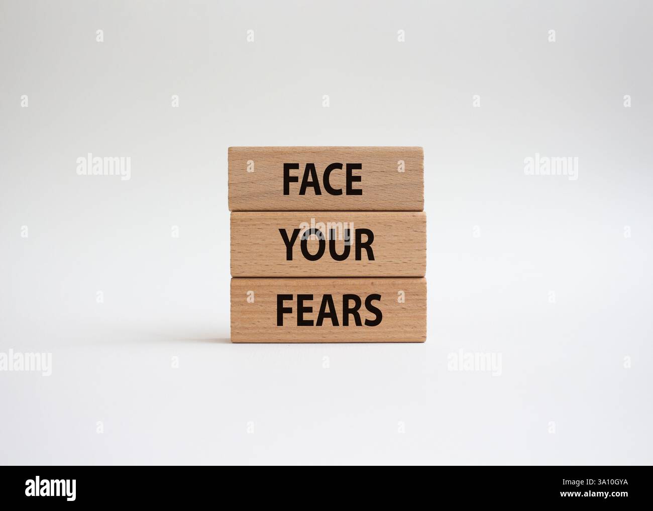 Face your Fears symbol. Wooden blocks with words Face your Fears ...