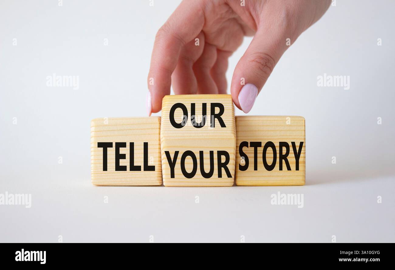 Tell Your or Our story symbol. Businessman hand turns wooden cubes and ...