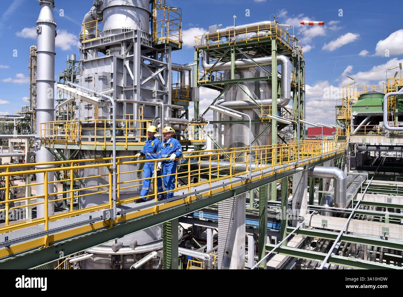 group of workers professional equipment in a petroleum refinery ...