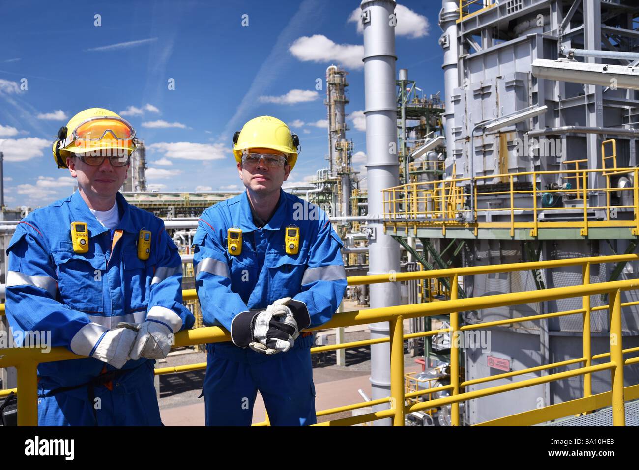 group of workers professional equipment in a petroleum refinery ...