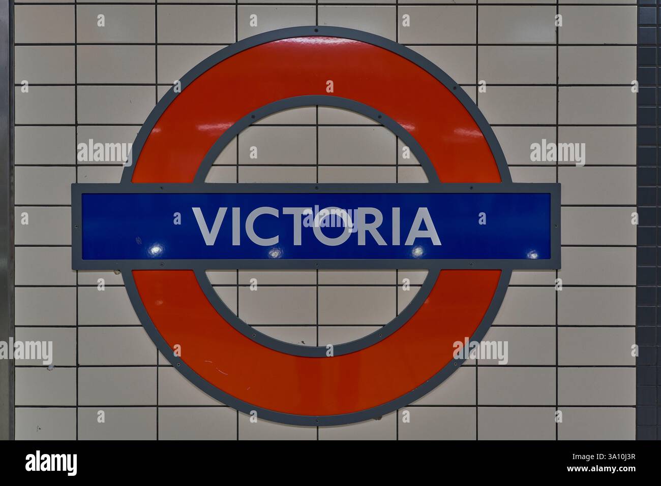 Sign of Victoria station in London Underground with white tiled ...