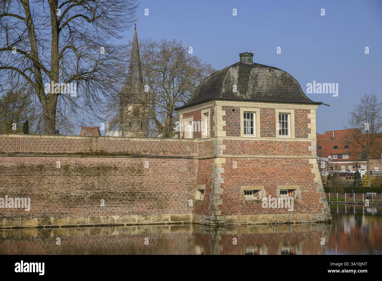Tower on the edge of a moat with surrounding castle and trees, ahaus ...