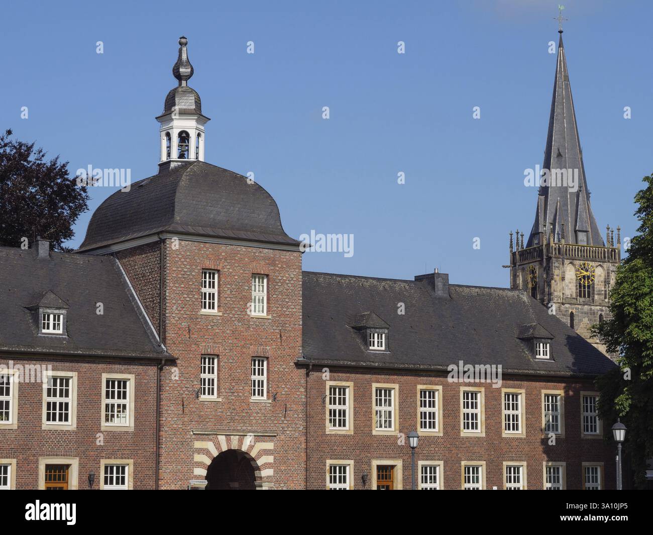 Close-up of a historic brick building with towers and dome, ahaus ...