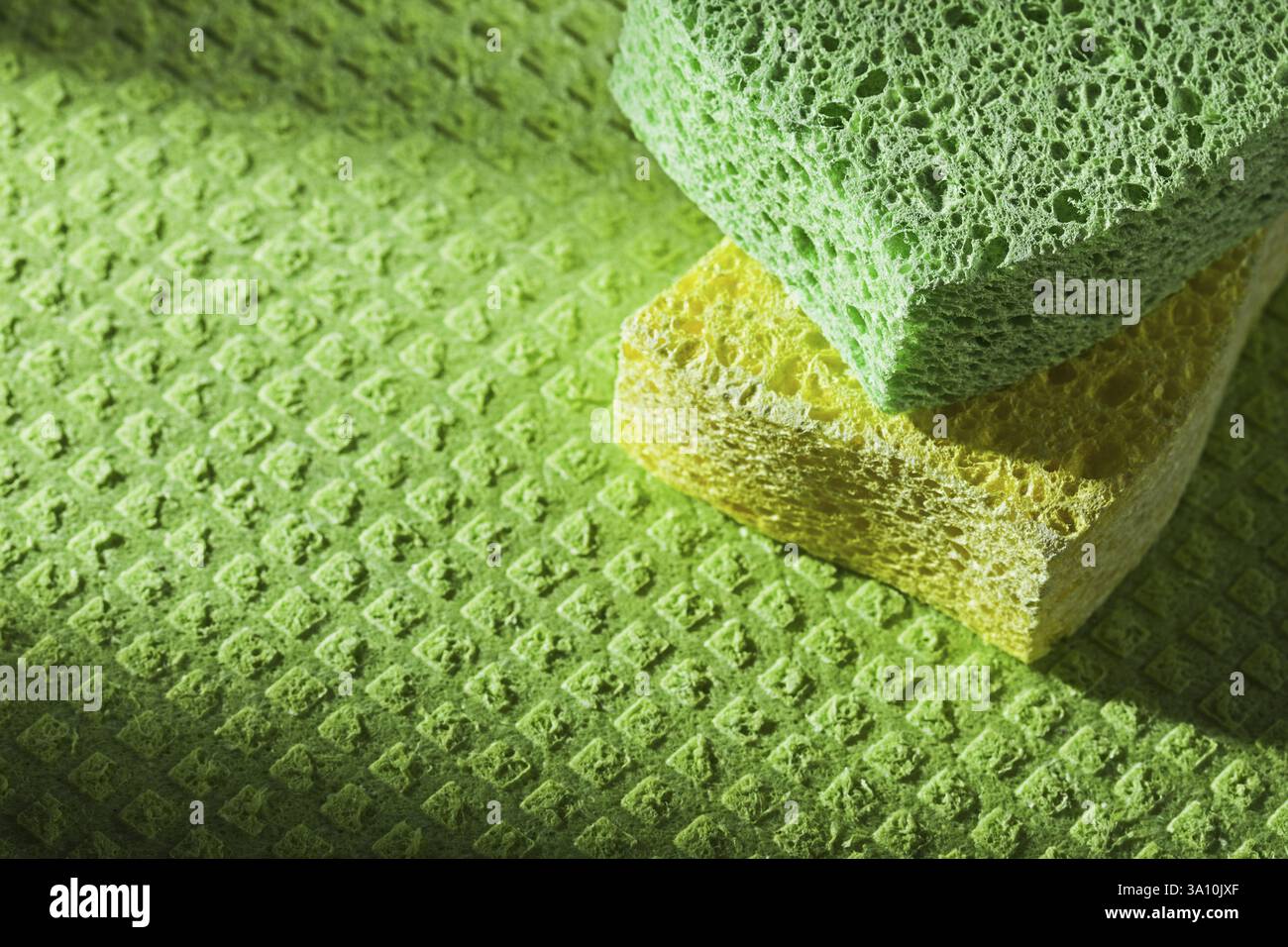 Cleaning kitchen sponges on washcloth Stock Photo - Alamy