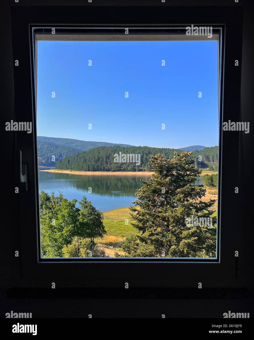 View of a vast body of water through a window Stock Photo - Alamy