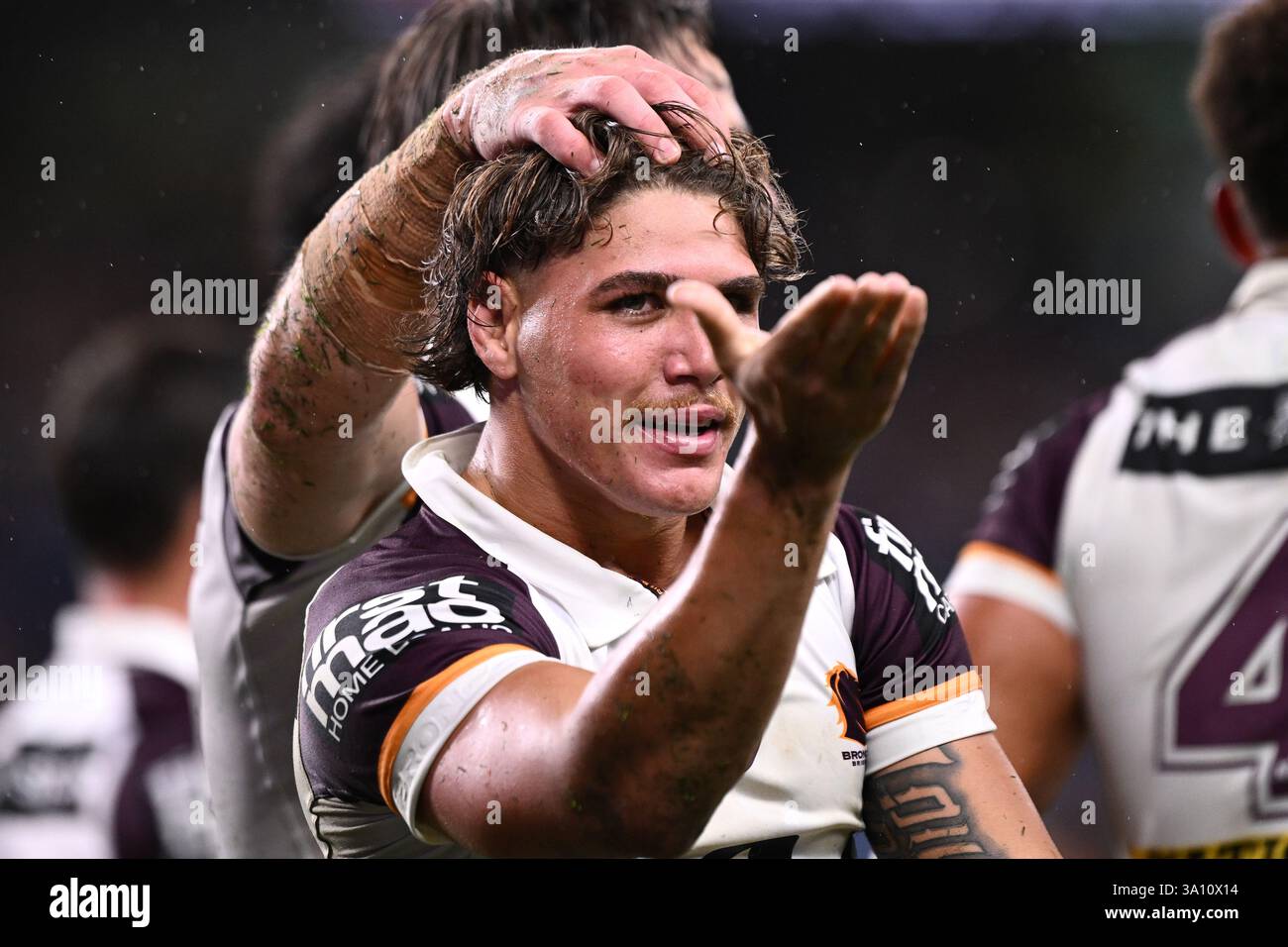 Reece Walsh of the Broncos gestures after scoring a try during the NRL ...